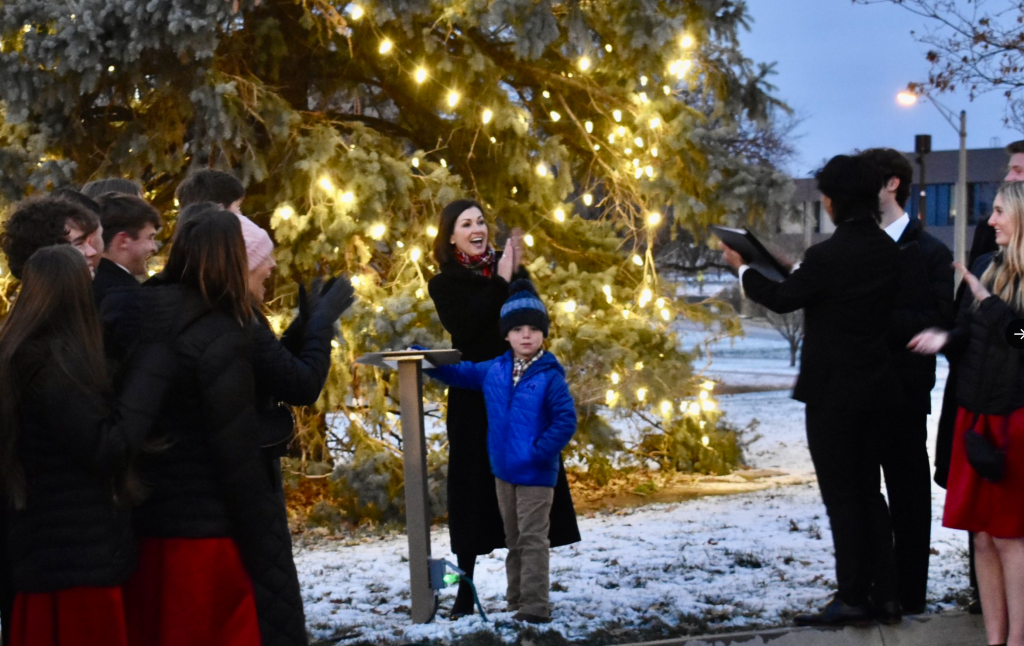 Kim Reynolds and Christian private school students light Christmas tree ...